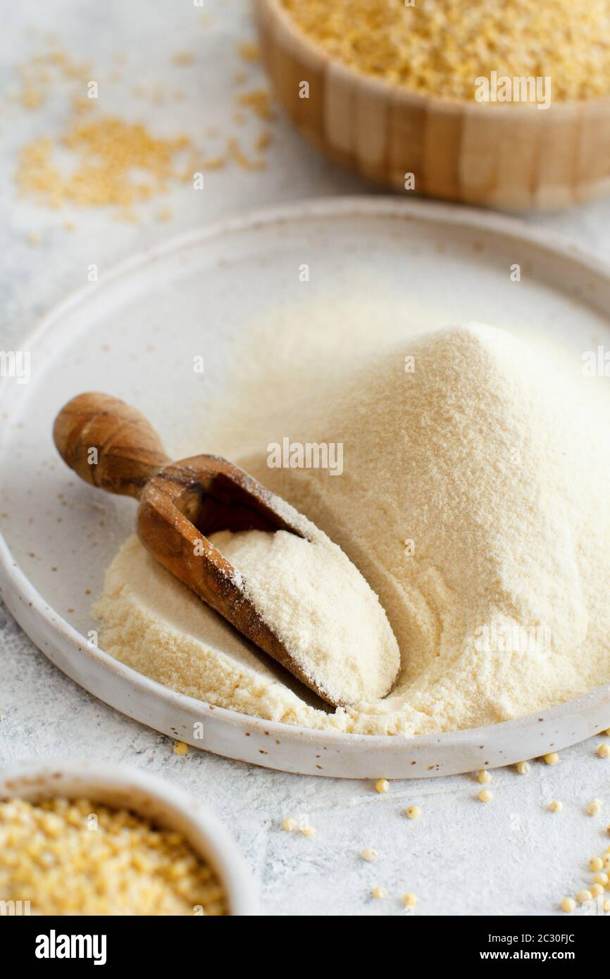 Hulled millet flour and grain close up Stock Photo - Alamy