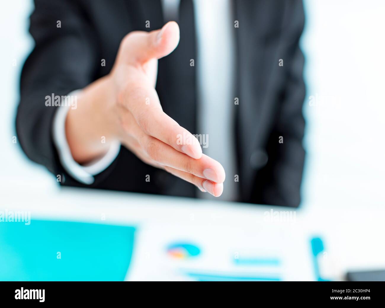 closeup businessman hand reaching out for a handshake Stock Photo - Alamy