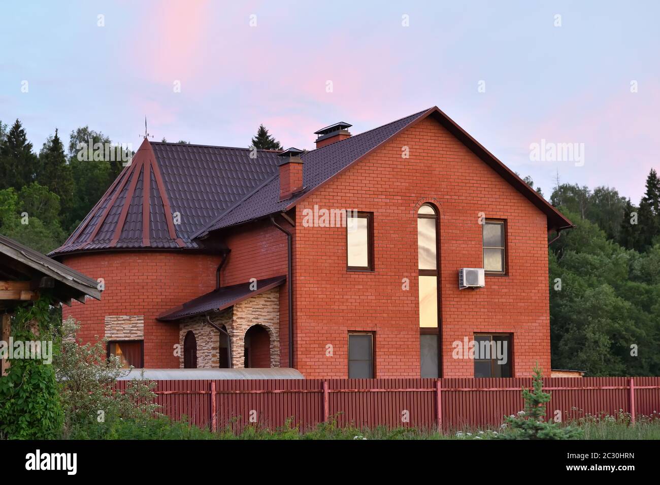 Red brick country house in suburb at summer sunset. Russia. Moscow ...