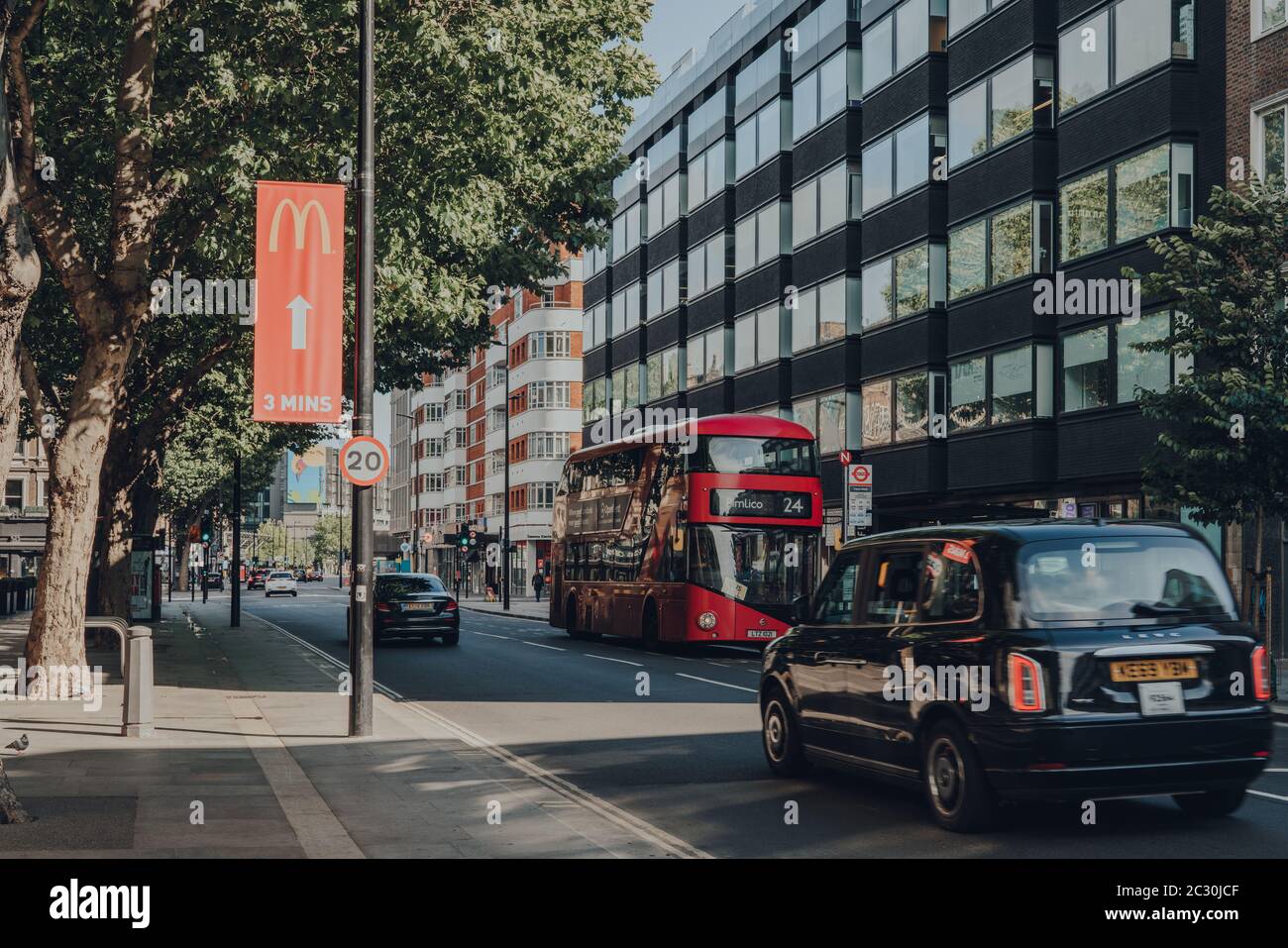 London, UK - June 13, 2020: Bus at a bus stop on Tottenham Court Road ...