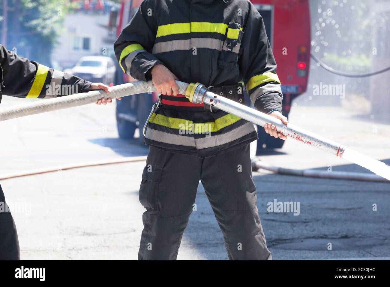 Firefighters at training Stock Photo - Alamy