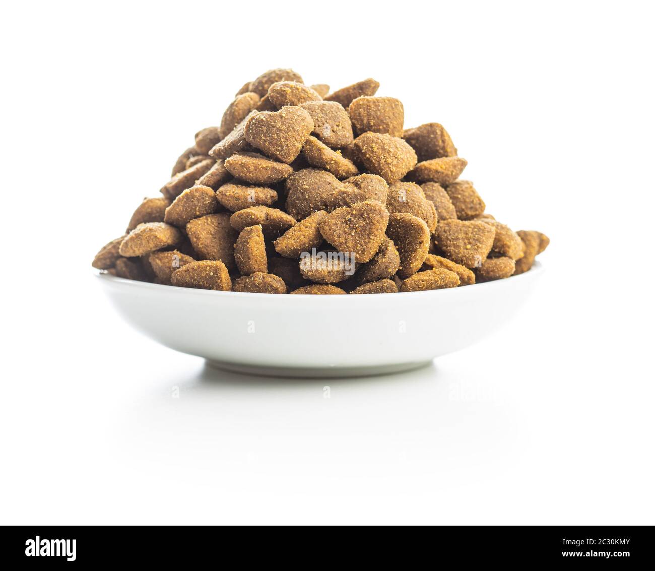 Dried kibble pet food in bowl. Heart shape dried animal food isolated ...