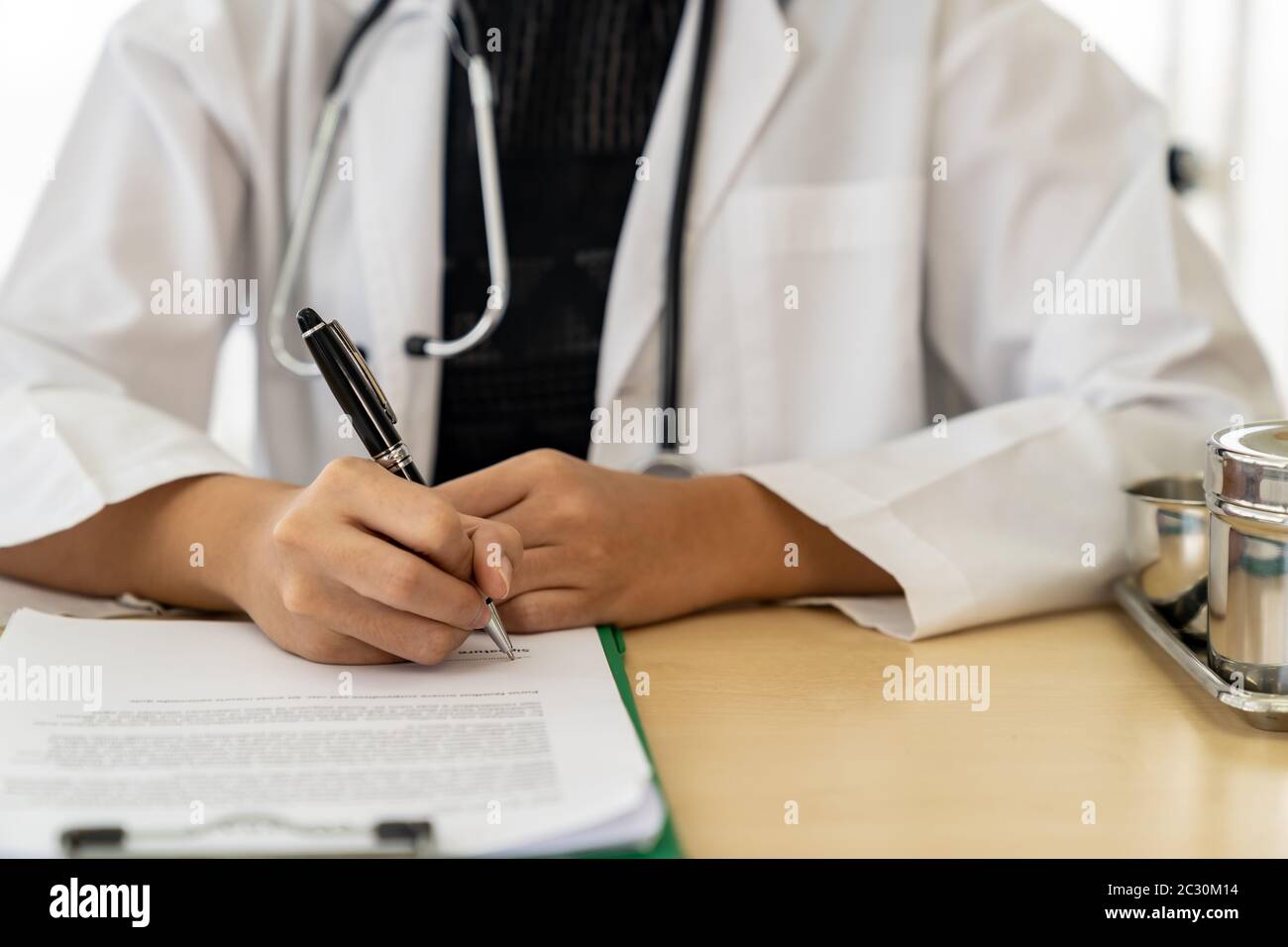 Closeup confident female doctor medical professional sitting in ...