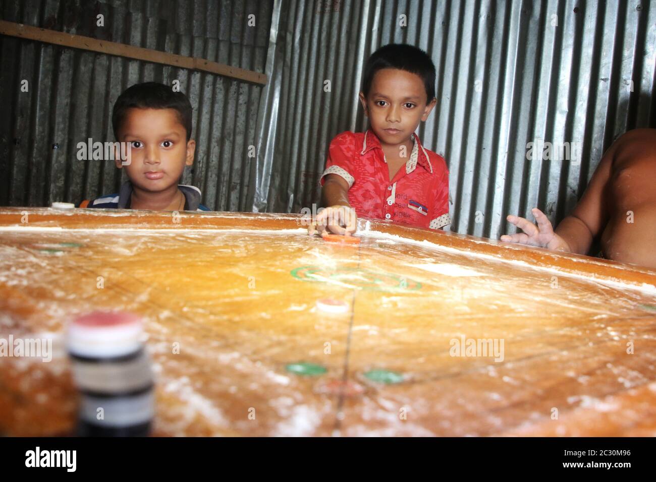 Slum boys playing an indoor game during the Coronavirus pandemic at ...