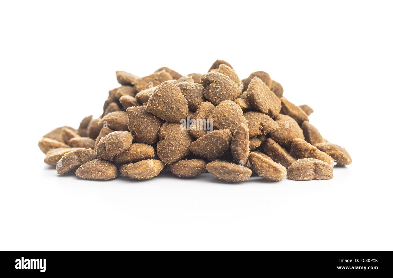 Dried kibble pet food. Heart shape dried animal food isolated on white ...