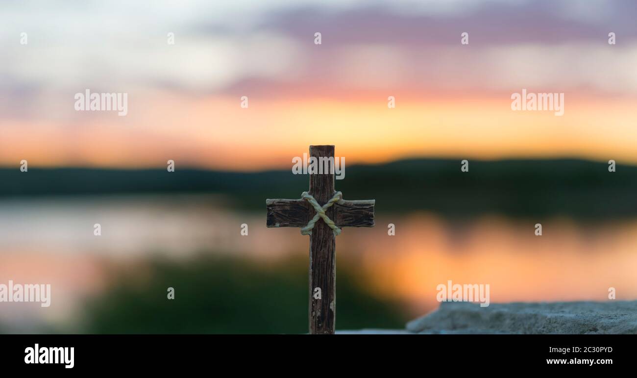 Holy cross on concrete and beautiful colors of sunset Stock Photo - Alamy