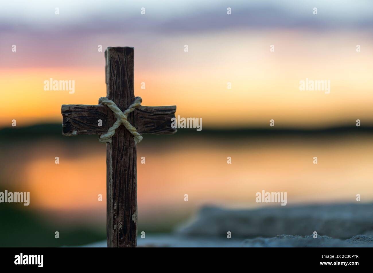 Holy cross on concrete and beautiful colors of sunset Stock Photo - Alamy