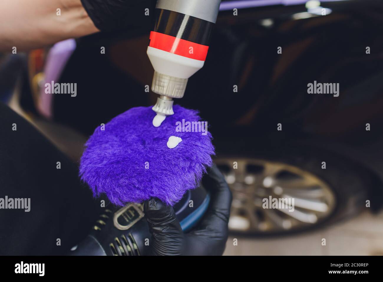 Car detailing - Hands with orbital polisher in auto repair shop ...