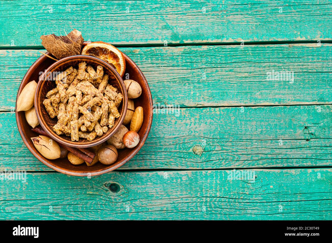 Organic uncooked granola cereal with mixed nuts.Copy space Stock Photo ...