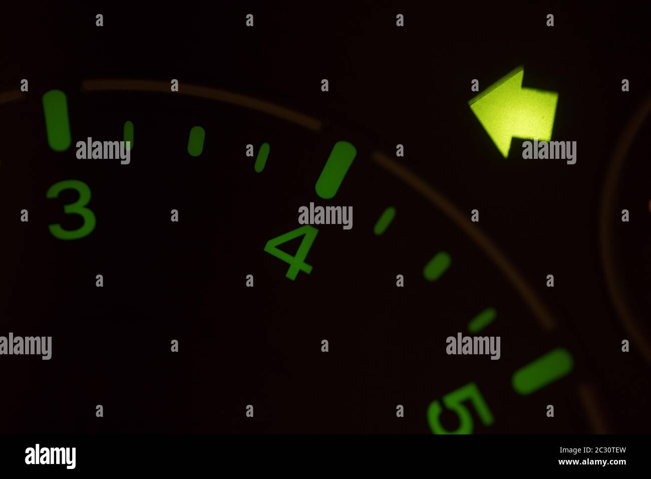 Close up shot of the turn signal icon displayed on a car dashboard ...