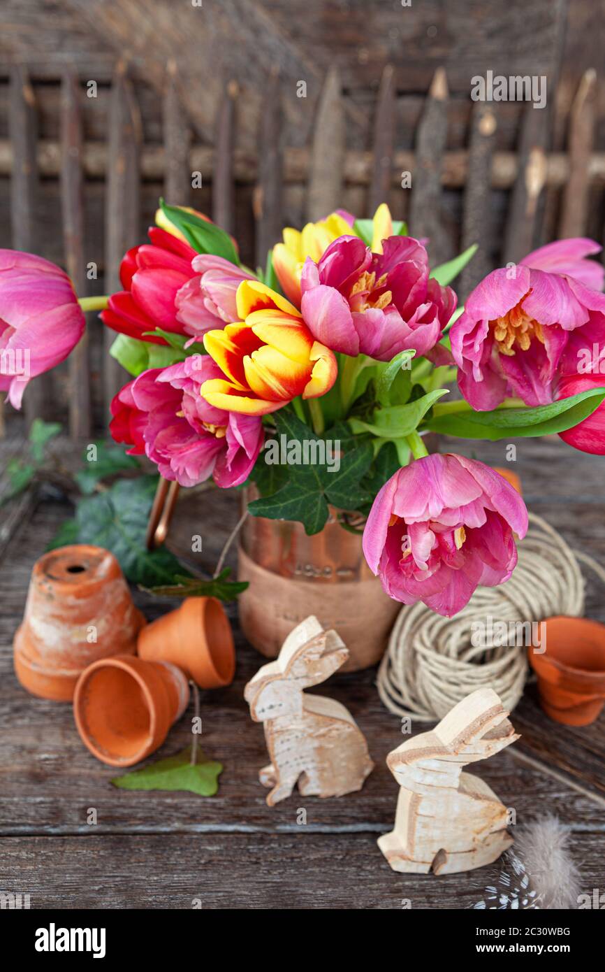 Colorful bunch of flowers with fresh tulips and ivy Stock Photo - Alamy