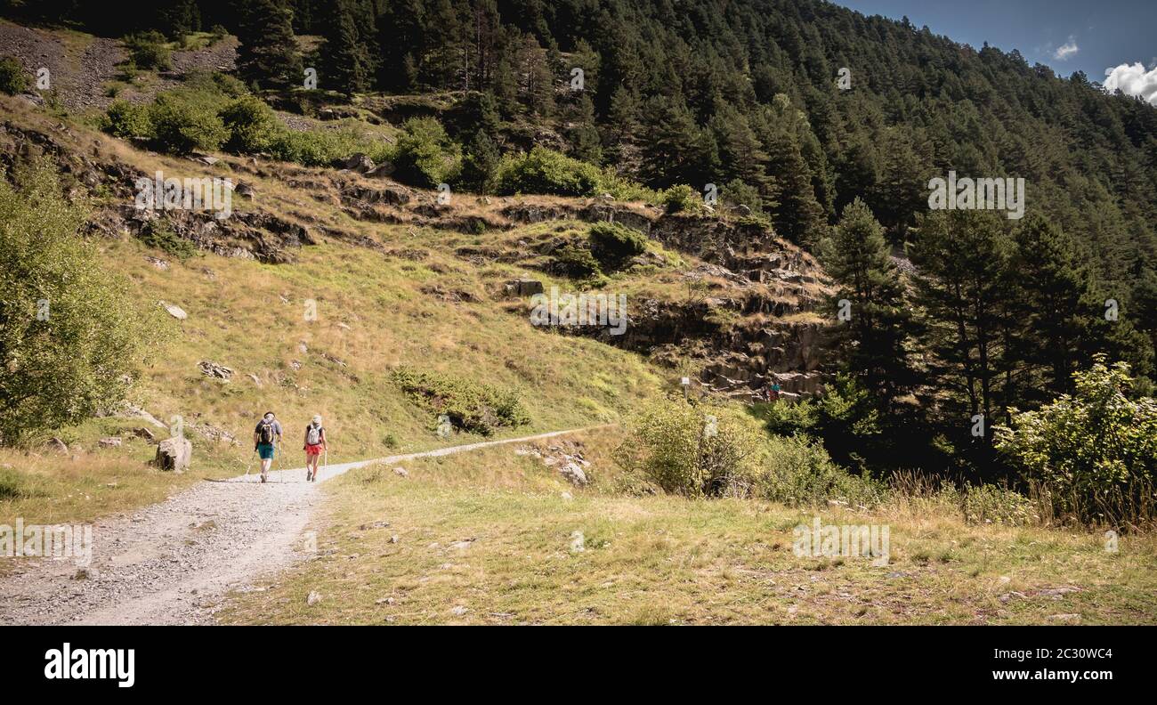hikers climbing a mountain path in the Pyrenees in France Stock Photo ...