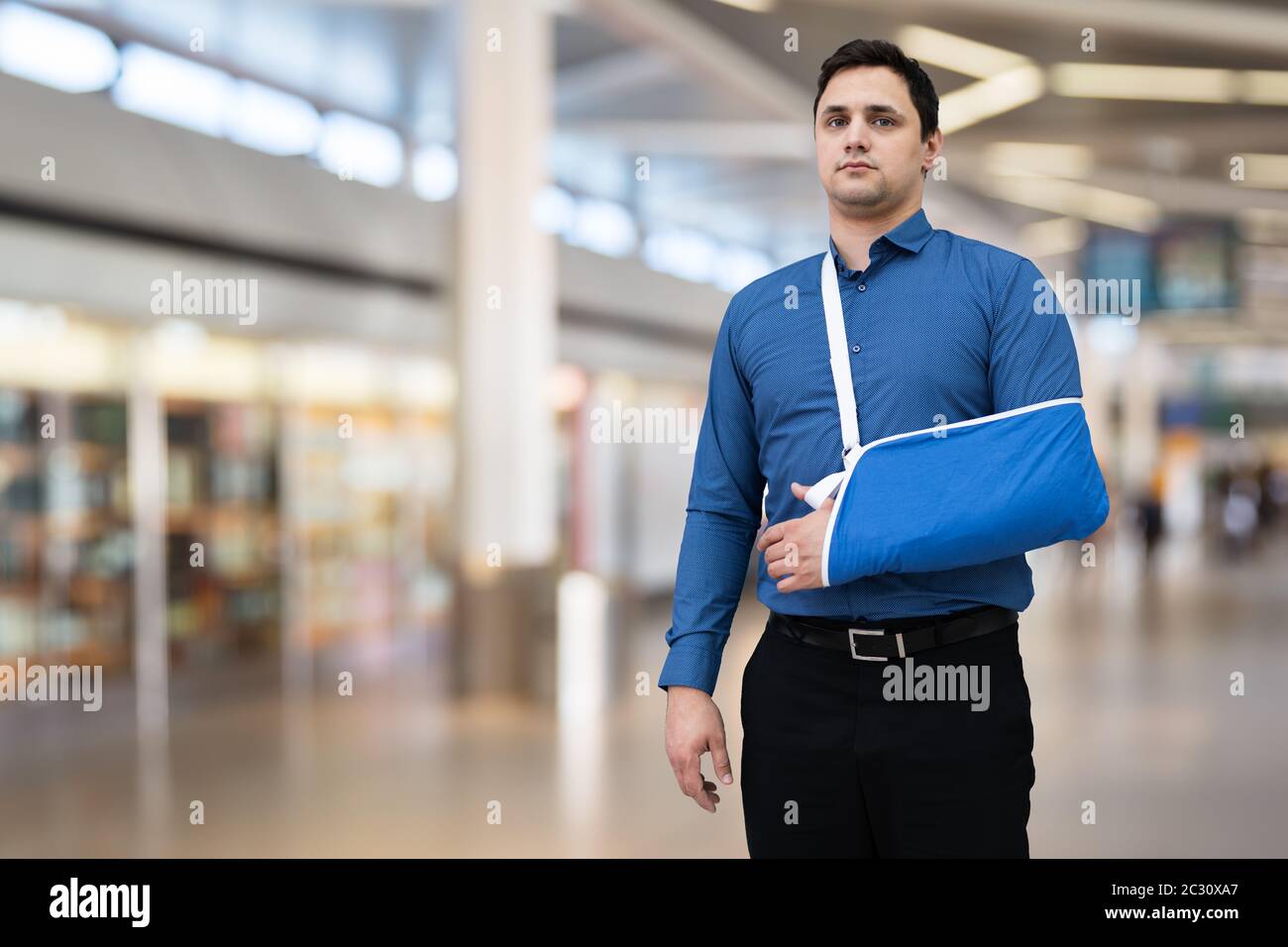 Man With Broken Arm In Airport Terminal Stock Photo - Alamy