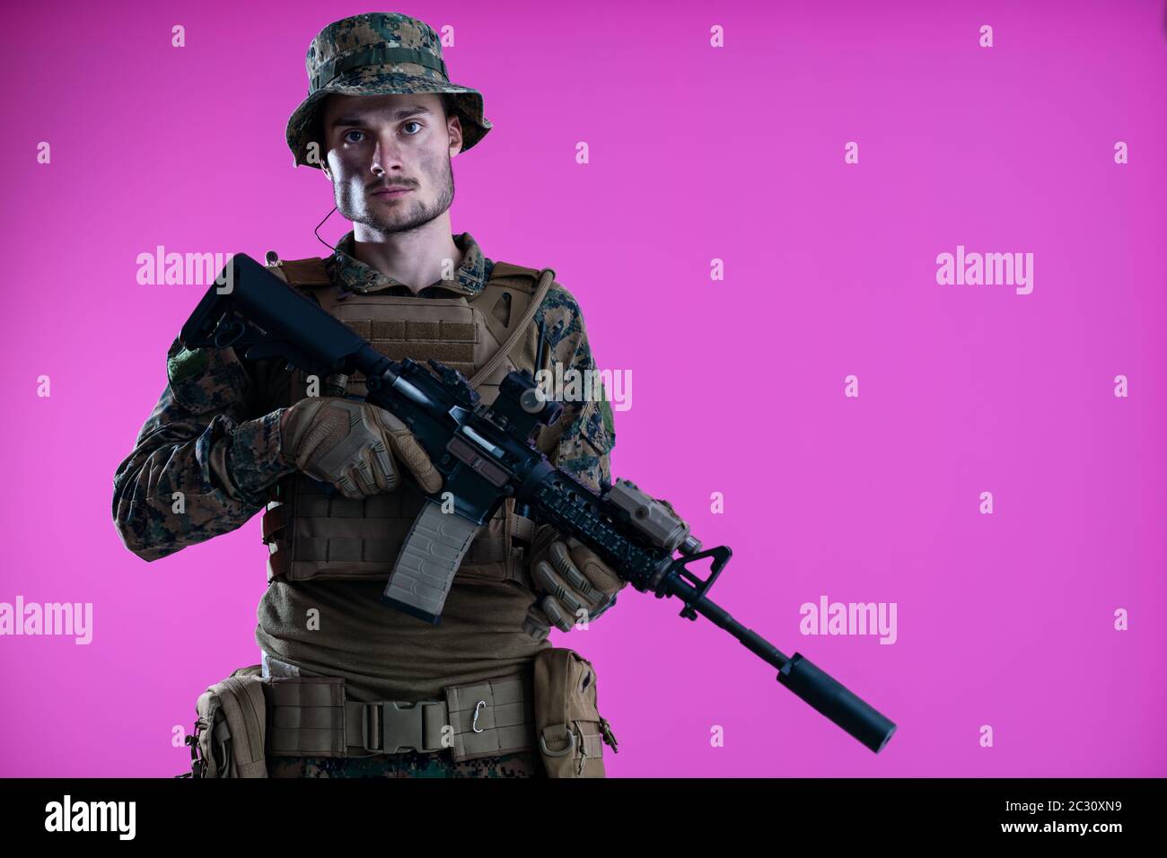modern warfare soldier pink backgorund Stock Photo - Alamy