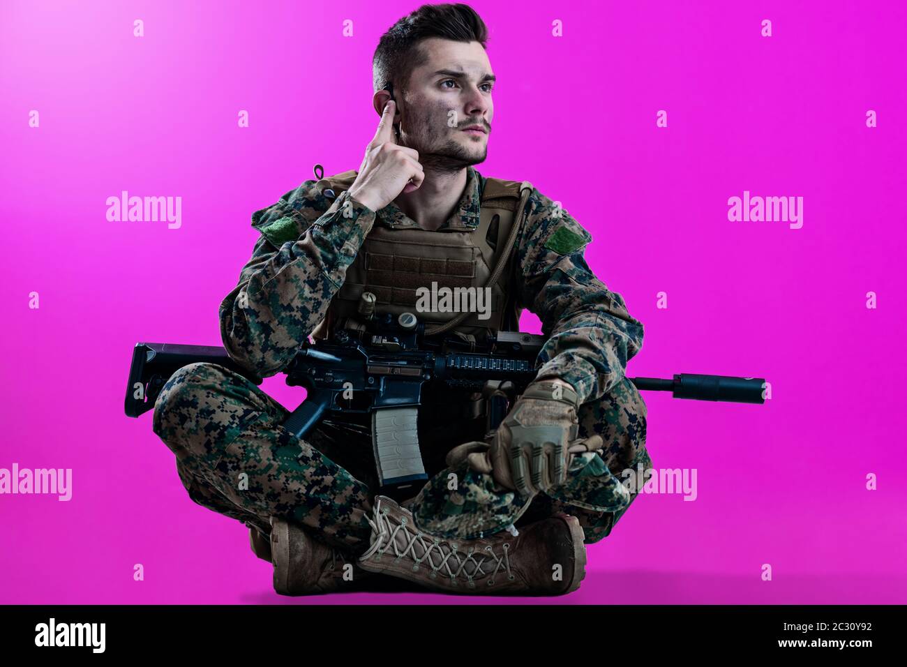 soldier preparing gear for action and checking communication Stock ...