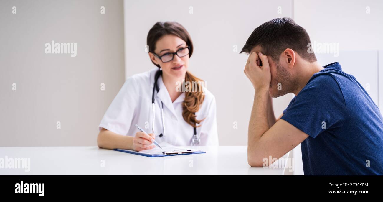 Psychologist comforting depressed man hi-res stock photography and ...