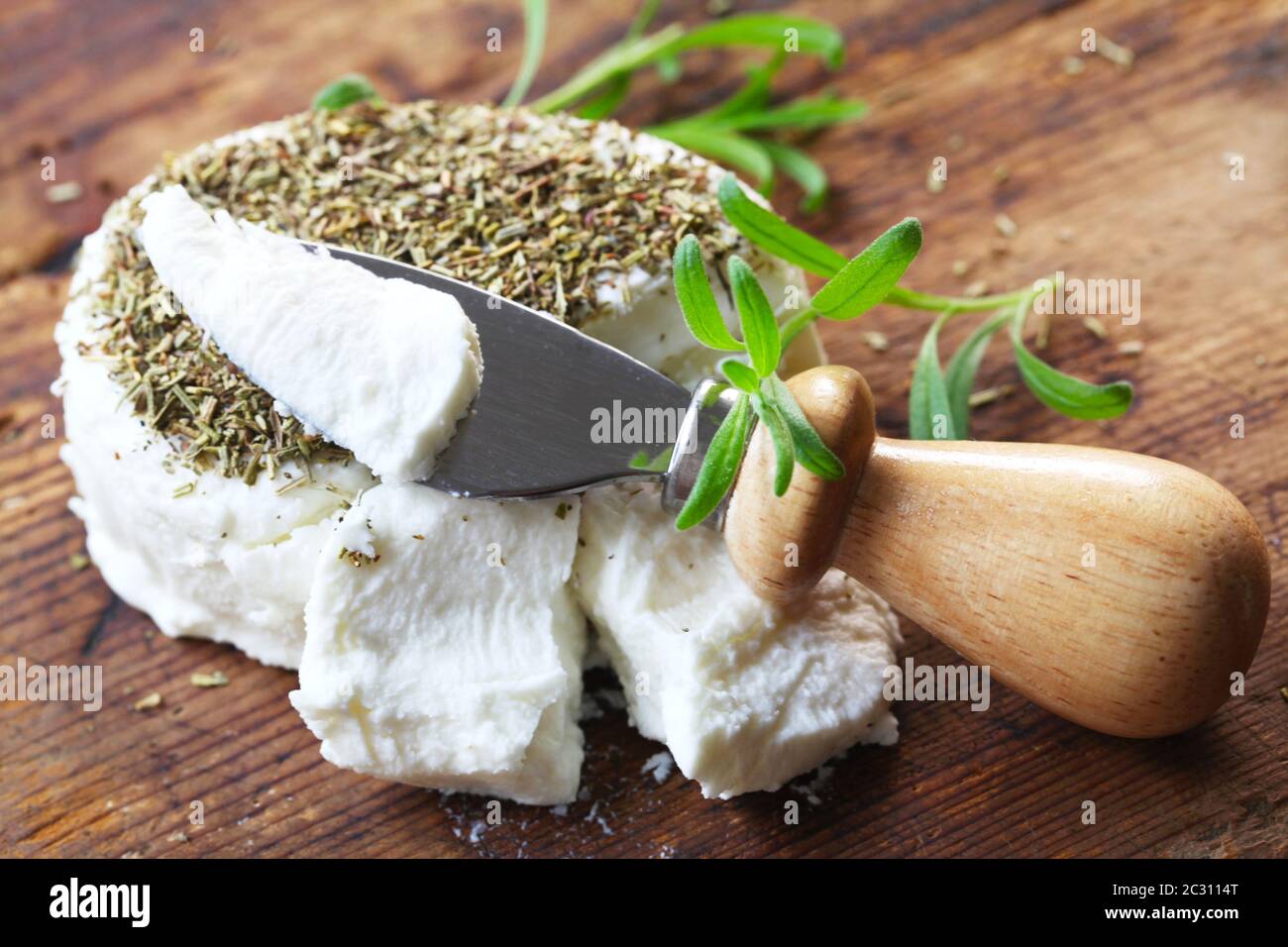 Goat Cheese With Dried Herbs Stock Photo - Alamy