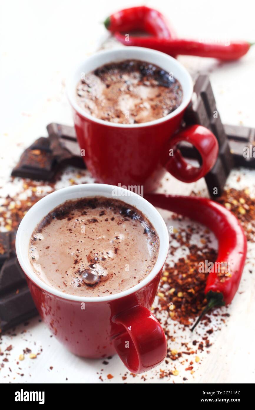 Hot Chocolate With Chilli In Red Cups Stock Photo - Alamy