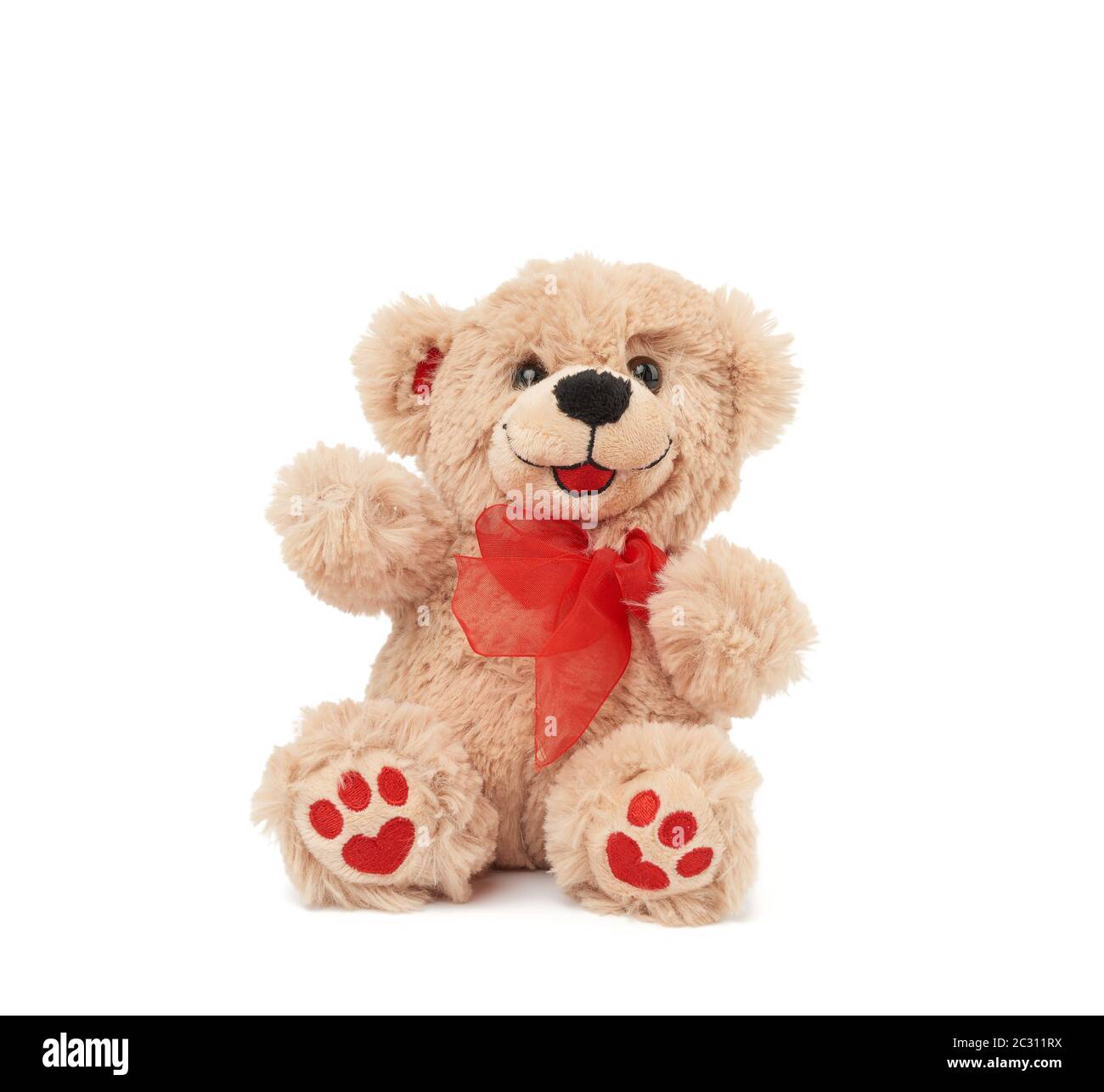 cute little brown teddy bear, toy is sitting on a white background ...