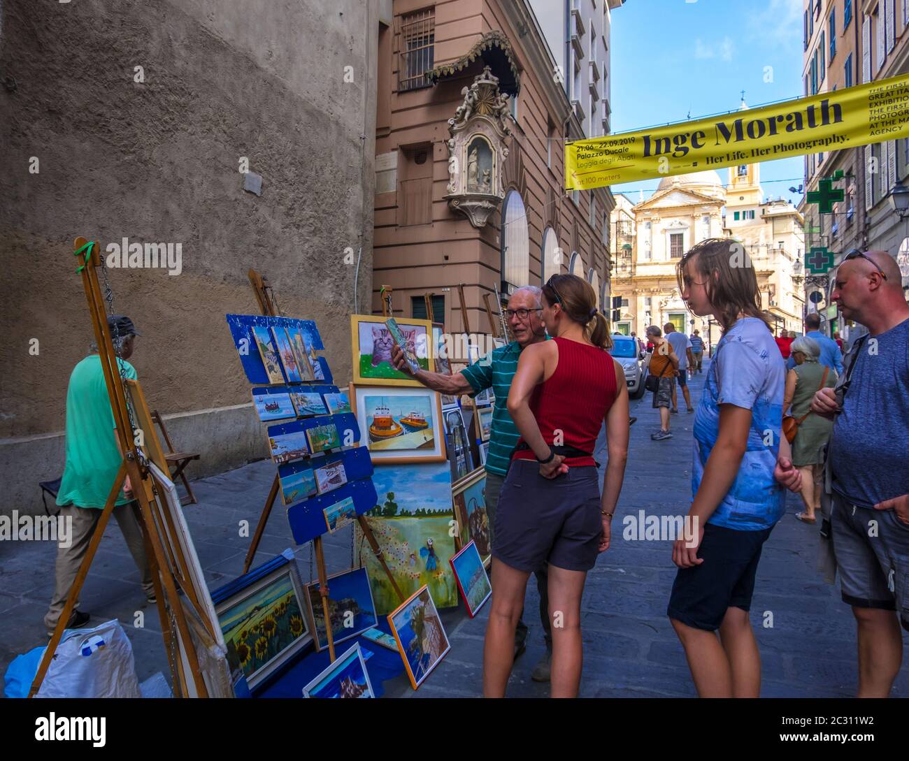 Genoa, Italy - August 18, 2019: Artist displaying and aiming to sell ...