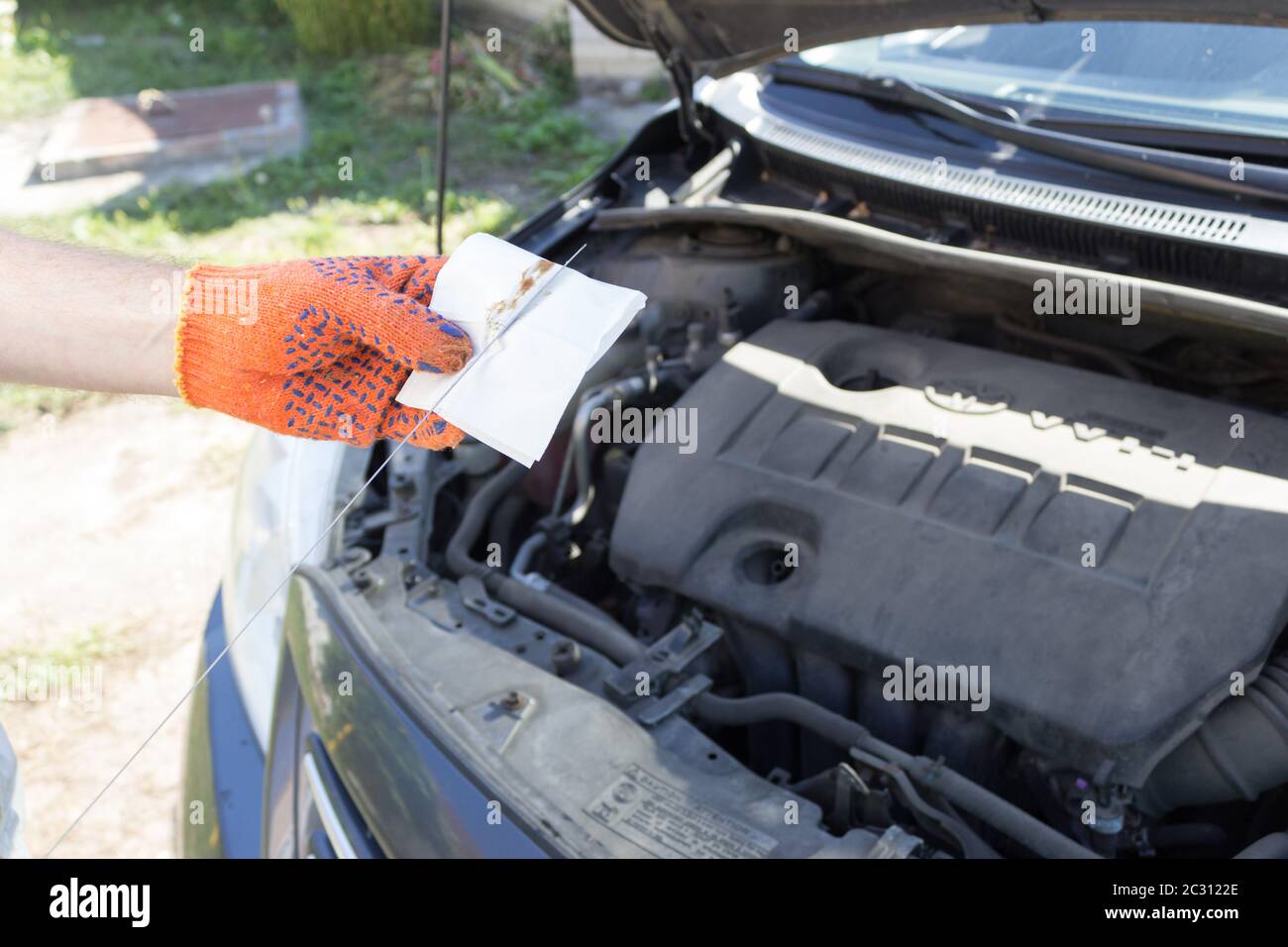 Checking the oil level in the car engine box Stock Photo - Alamy