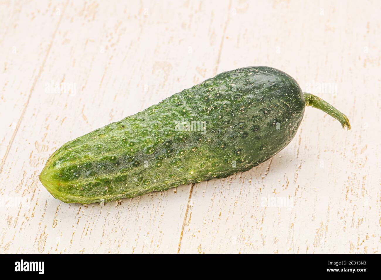 Green ripe fresh one cucumber over background Stock Photo - Alamy