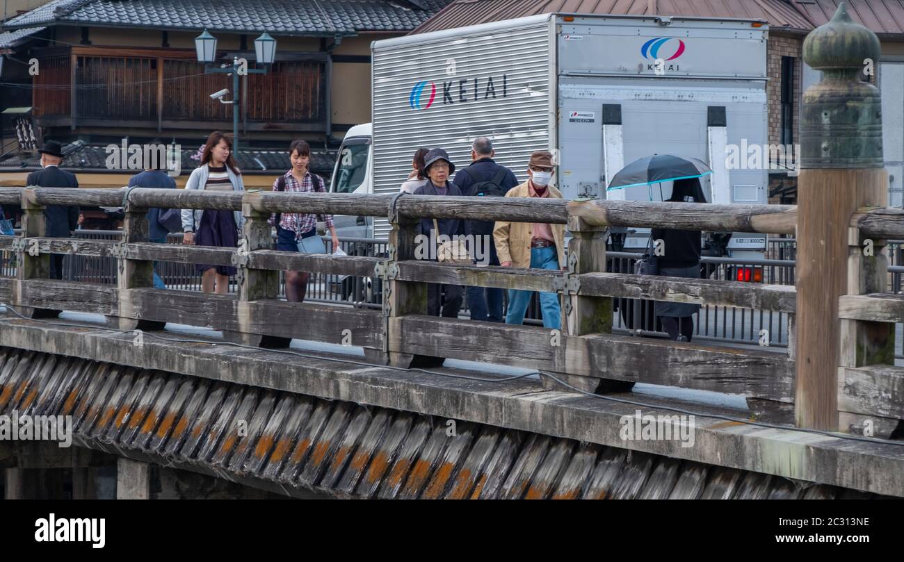 Pedestrian walking at Sanjo Bridge, Kyoto, Japan Stock Photo - Alamy