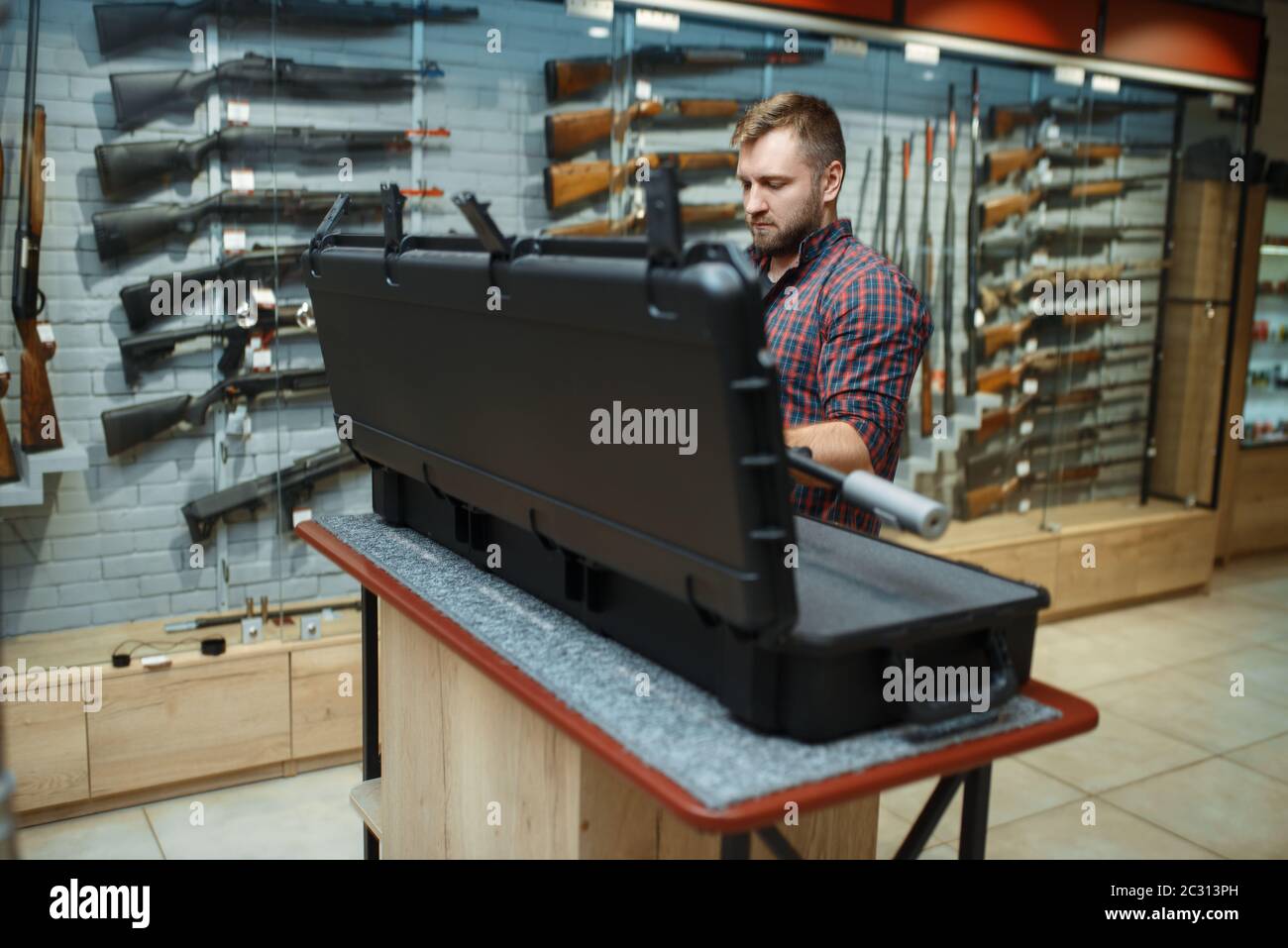 Person takes gun in shooting hi-res stock photography and images - Alamy
