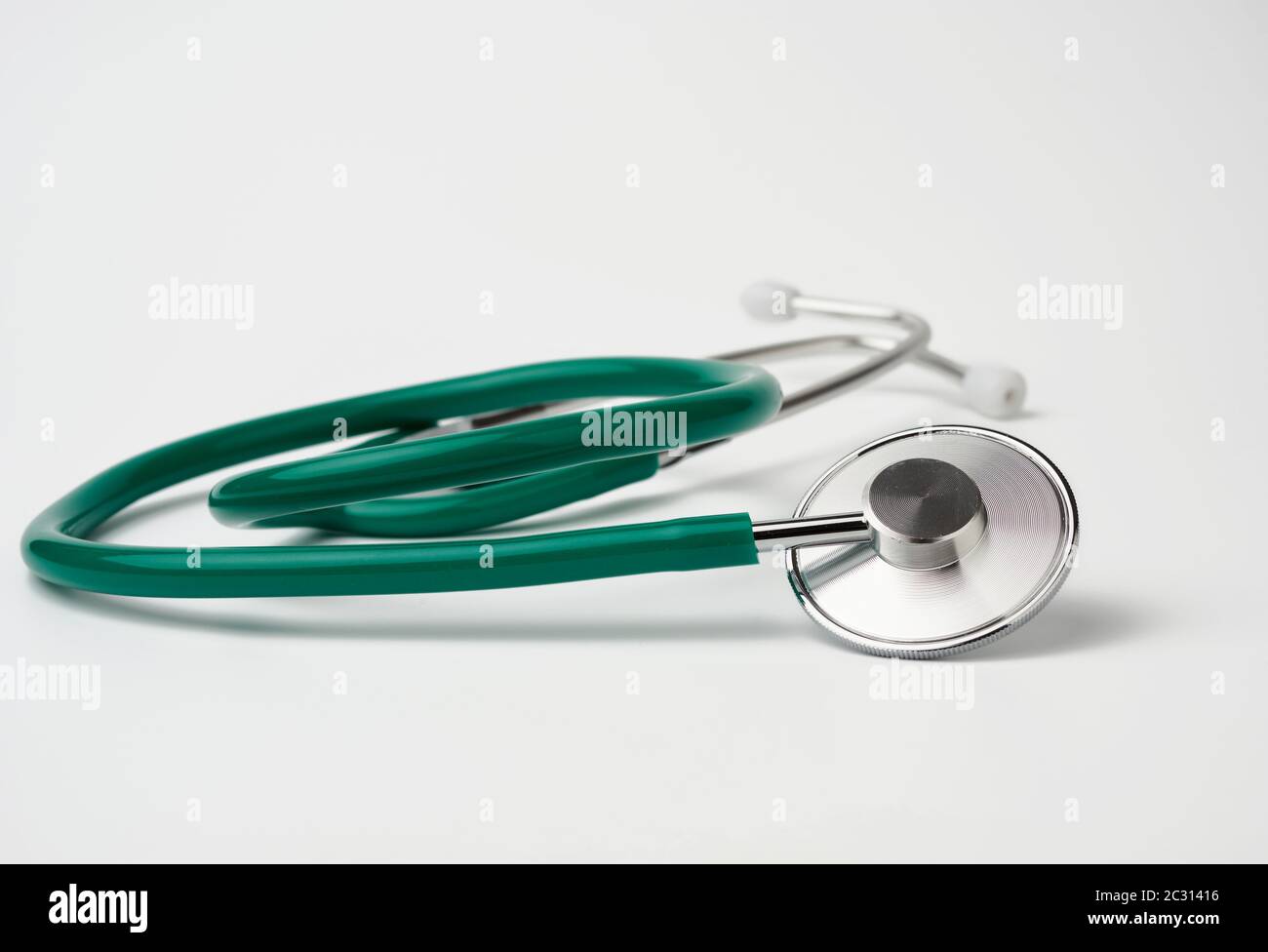 green medical stethoscope on white background, medical item for ...