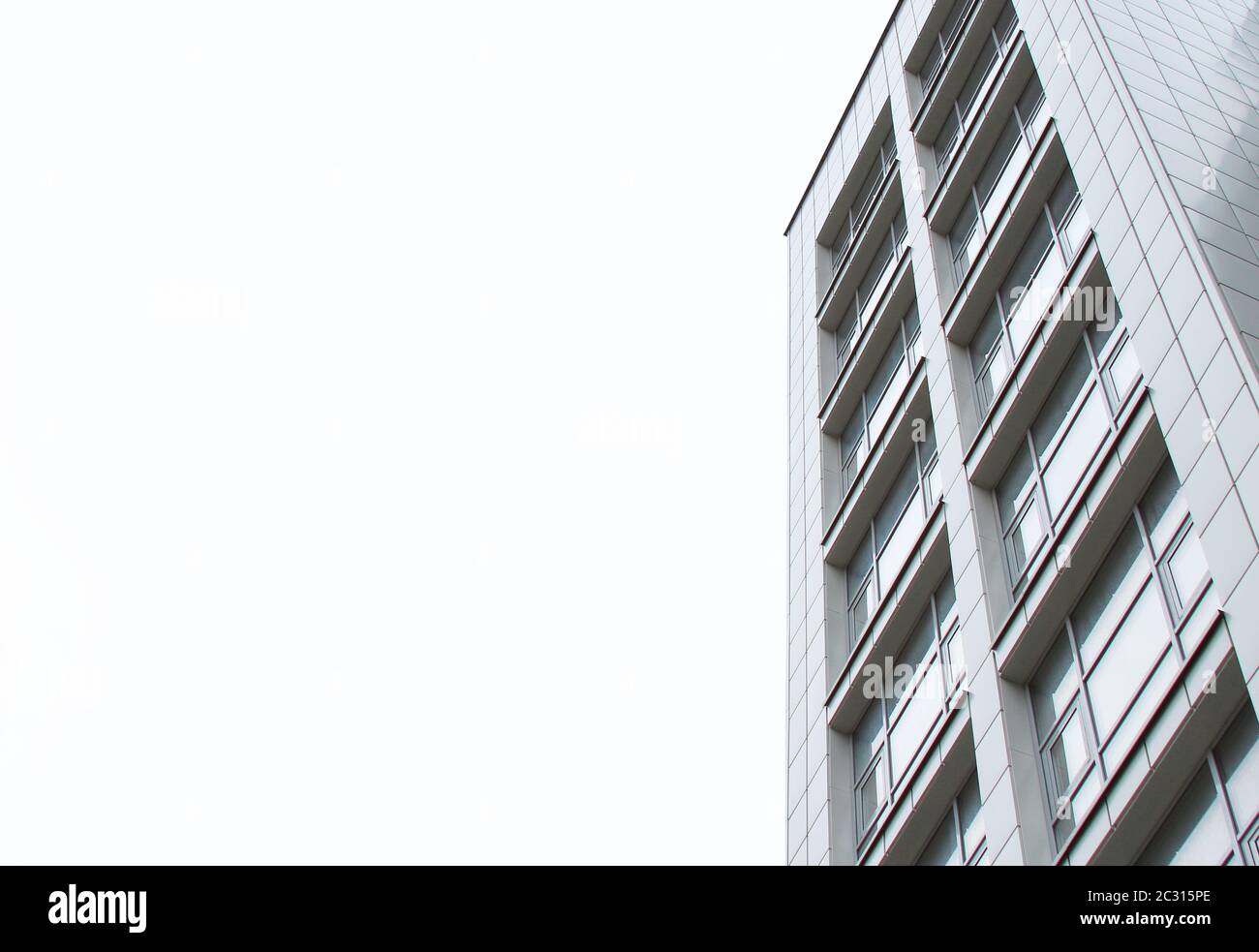 Part of the facade of a gray building with windows. The concept of a ...
