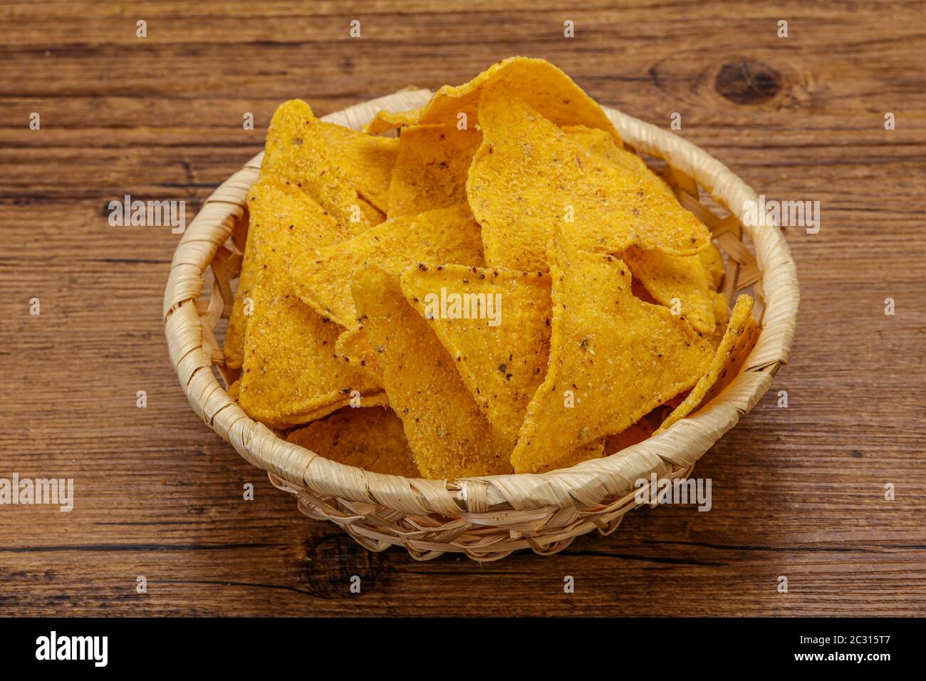 Mexican crunchy corn nachos triangle heap Stock Photo - Alamy