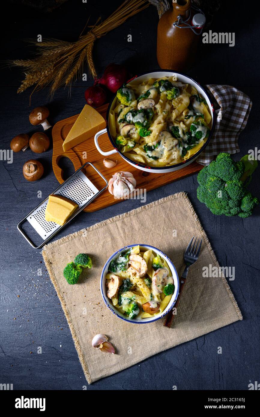 Real pasta with mushrooms, spinach and broccoli Stock Photo - Alamy