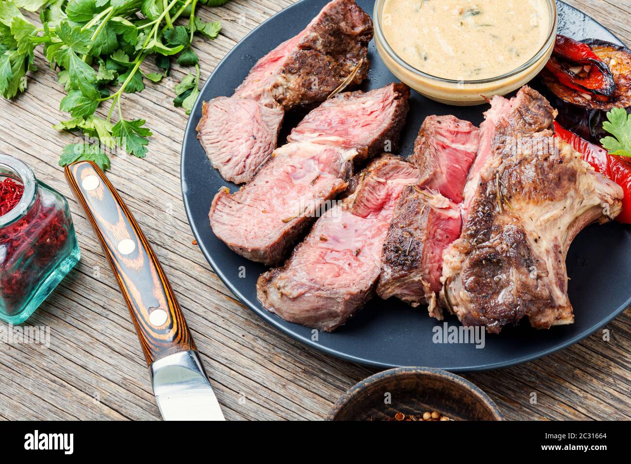 Delicious rare roast beef seasoned with fresh herbs Stock Photo - Alamy