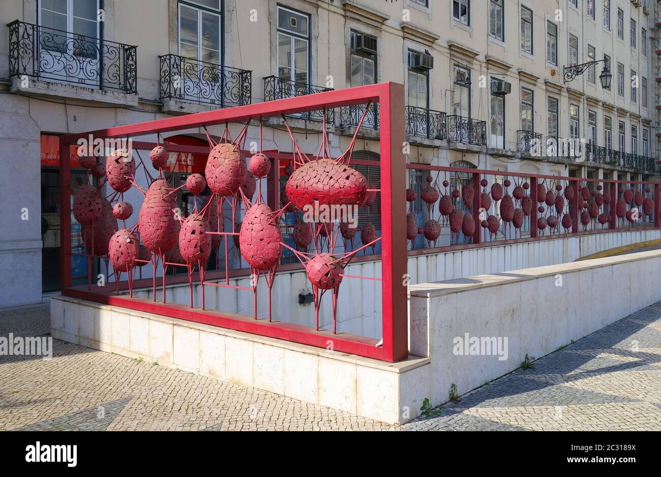 Red abstract installation on the street of Lisbon Stock Photo - Alamy