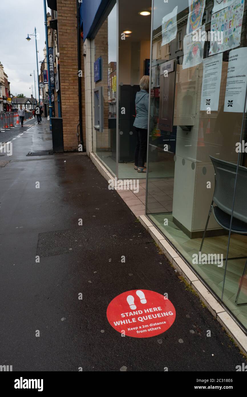 Stand here to queue sign hi-res stock photography and images - Alamy