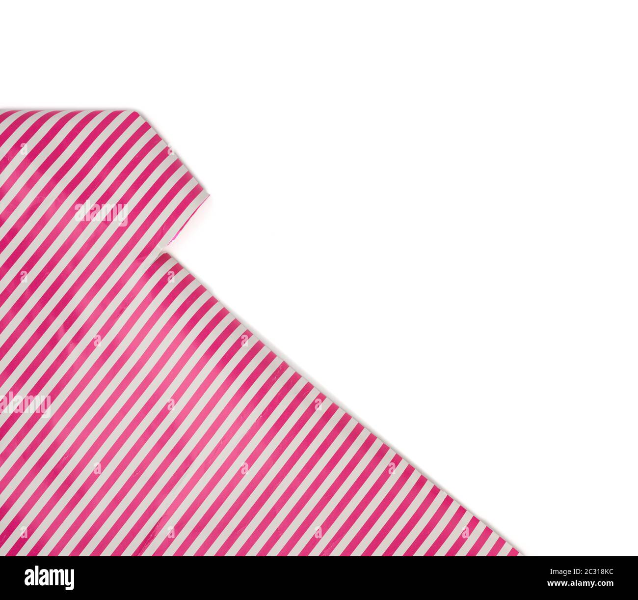 curved edge of a pink paper sheet is isolated on a white background ...