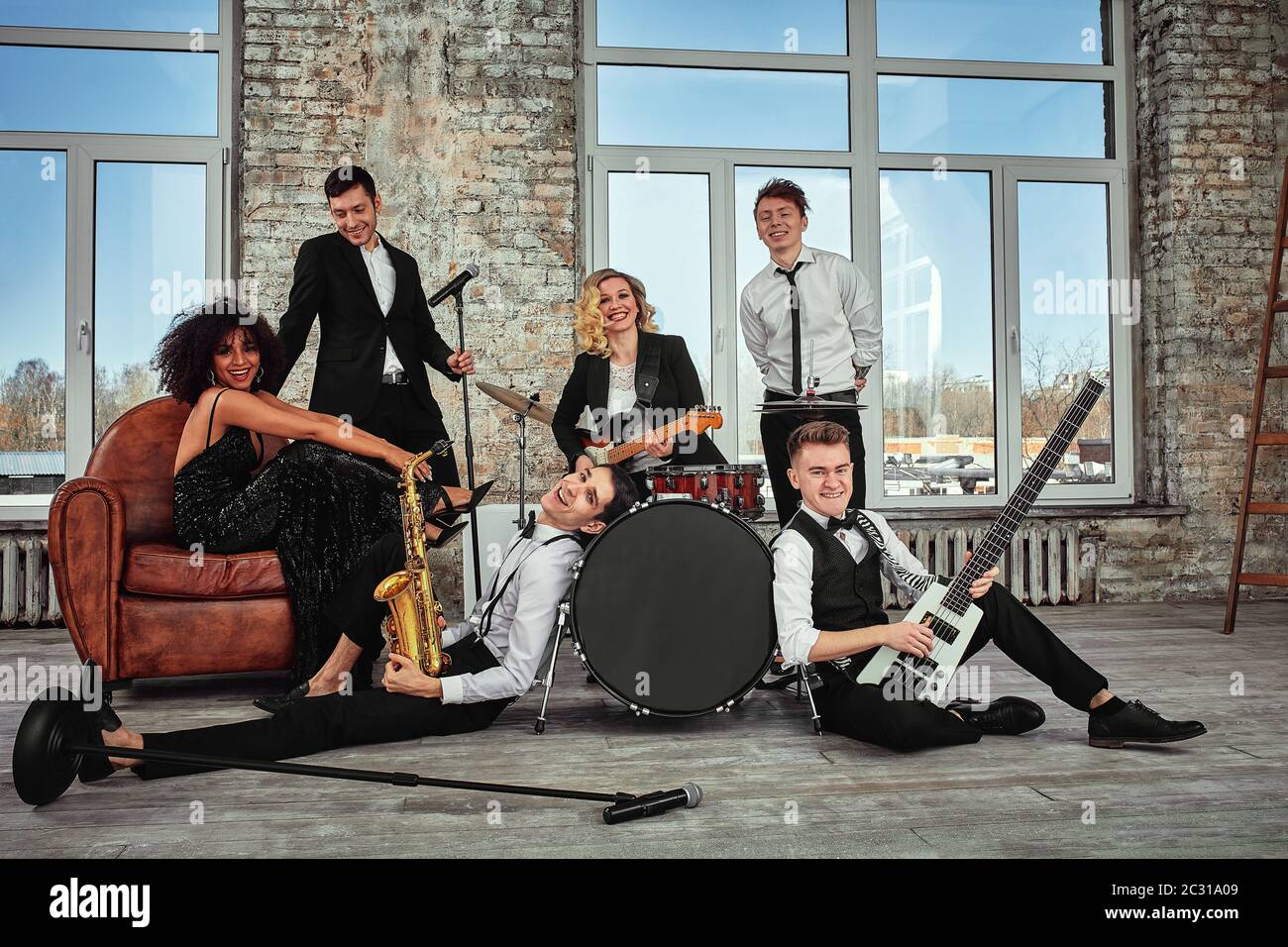 Photo of a lot of ethnic musical group in studio. Musicians and an ...