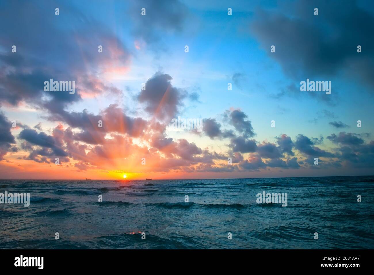 Sunrise over ocean Stock Photo - Alamy