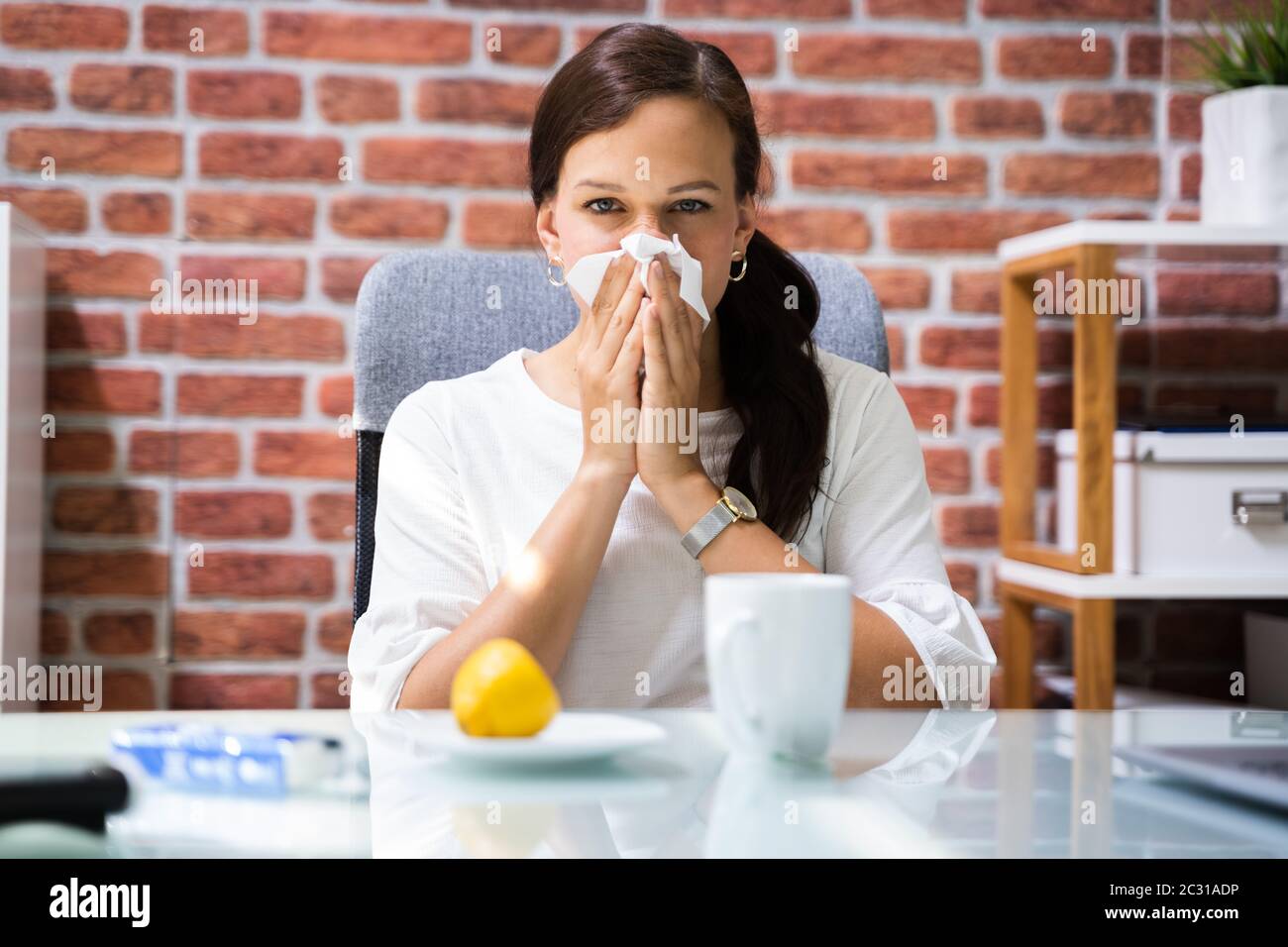 Sick Business Employee Or Worker Sneezing In Office Stock Photo - Alamy