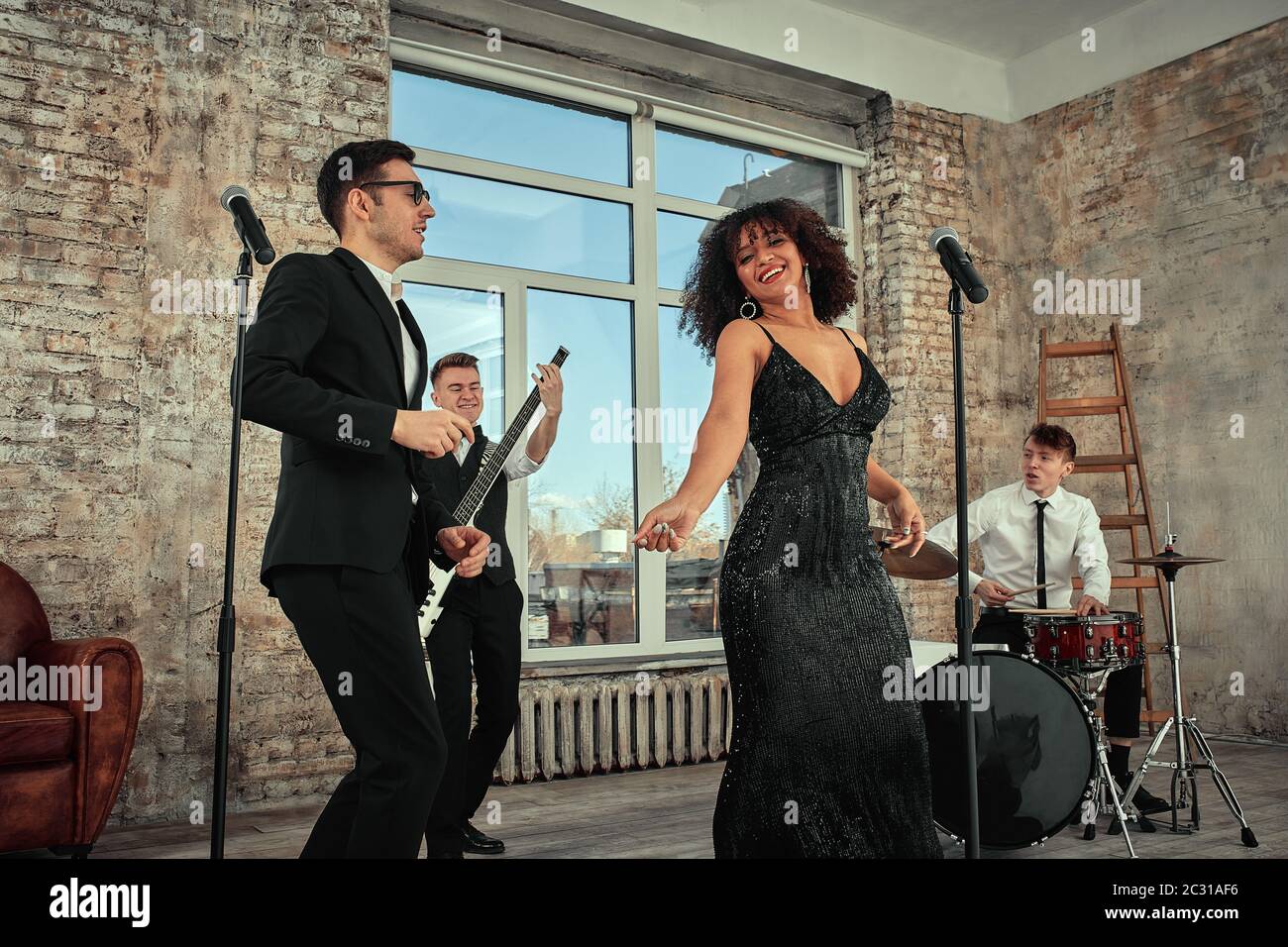 Photo of a lot of ethnic musical group in studio. Musicians and an ...