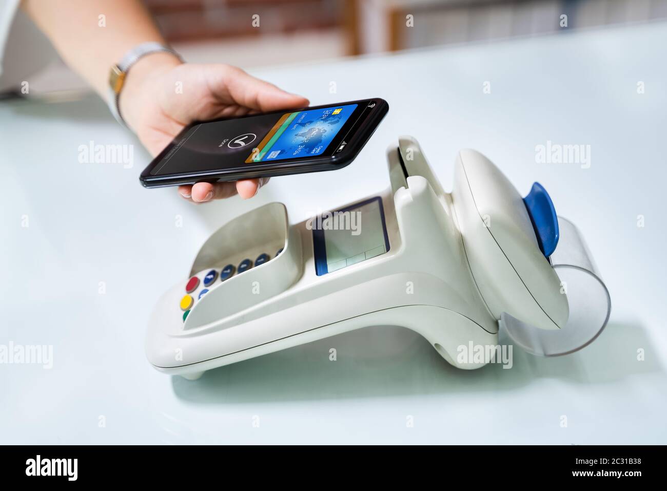 Paying With Mobile Phone To Cashier Using NFC Technology Stock Photo ...