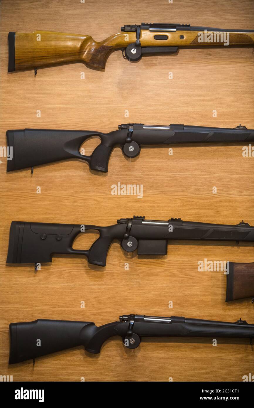 Close up shot of some rifles on a wall Stock Photo - Alamy