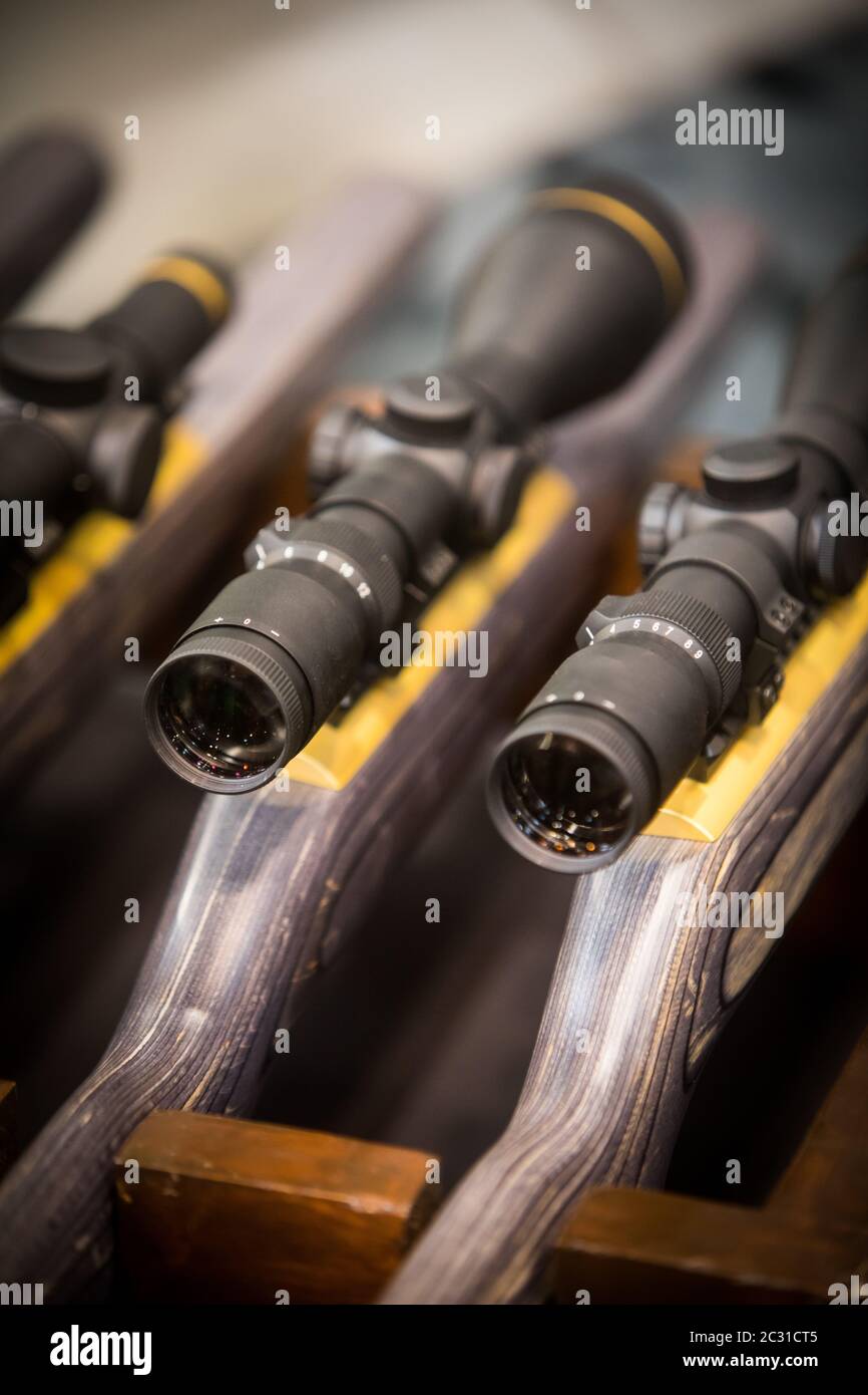 Close up shot of some rifles with scopes Stock Photo - Alamy