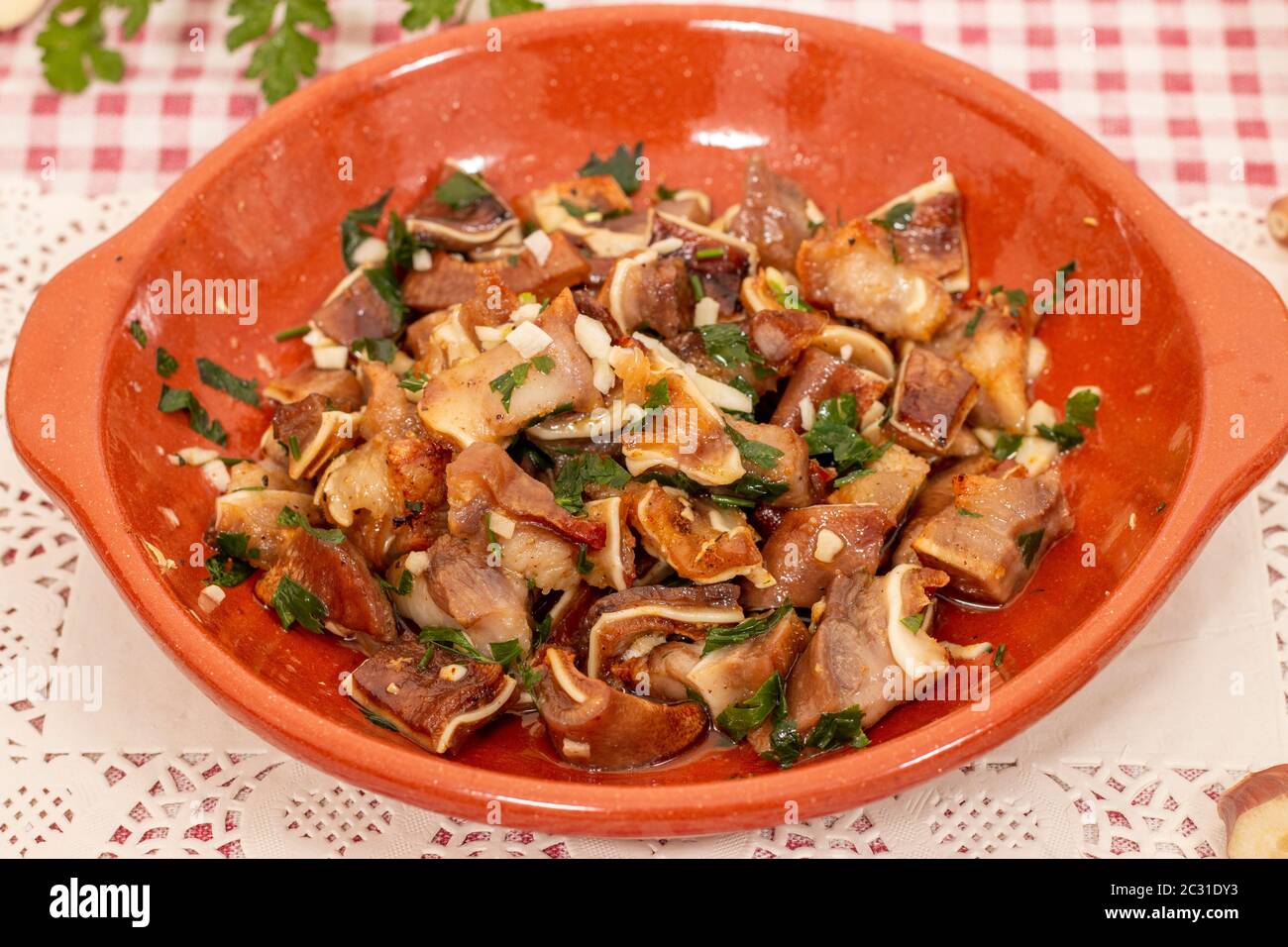 roasted pig ear with garlic and olive oil Stock Photo - Alamy