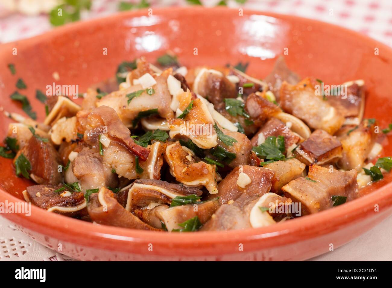 roasted pig ear with garlic and olive oil Stock Photo - Alamy