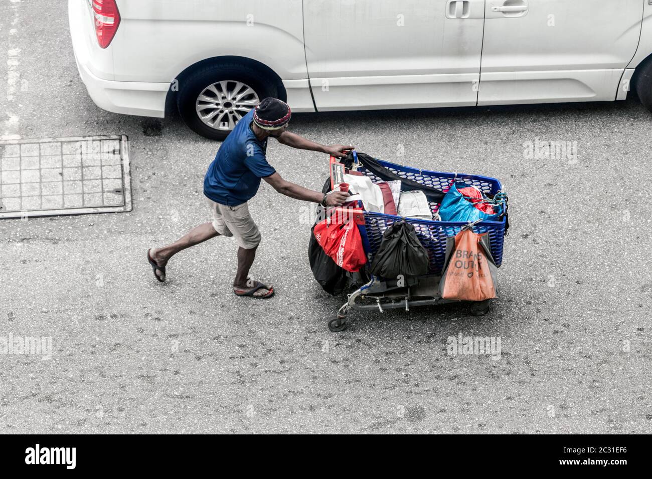 Homeless man pushing shopping cart hi-res stock photography and images ...