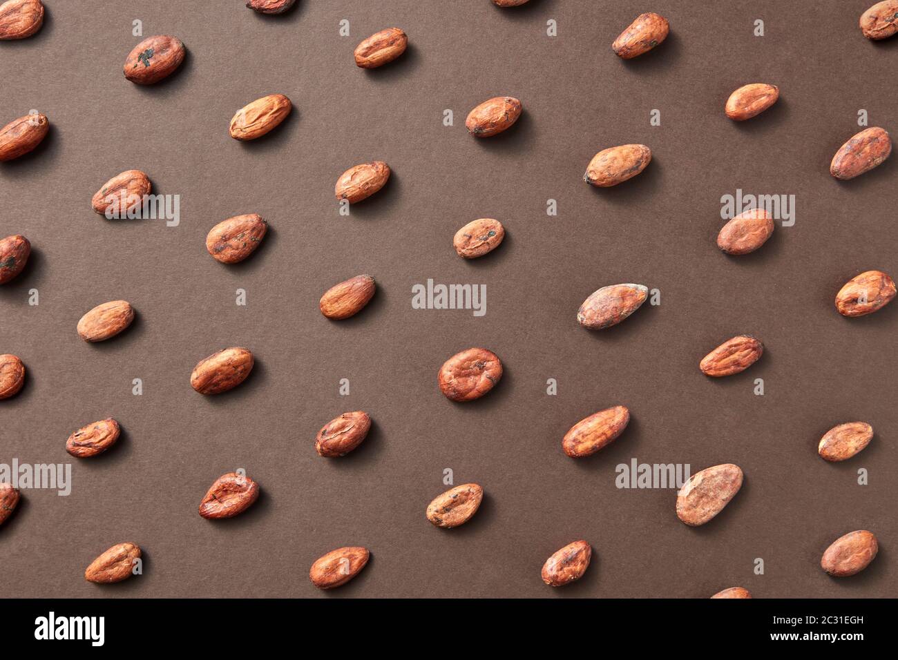Creative background from cocoa beans Stock Photo - Alamy