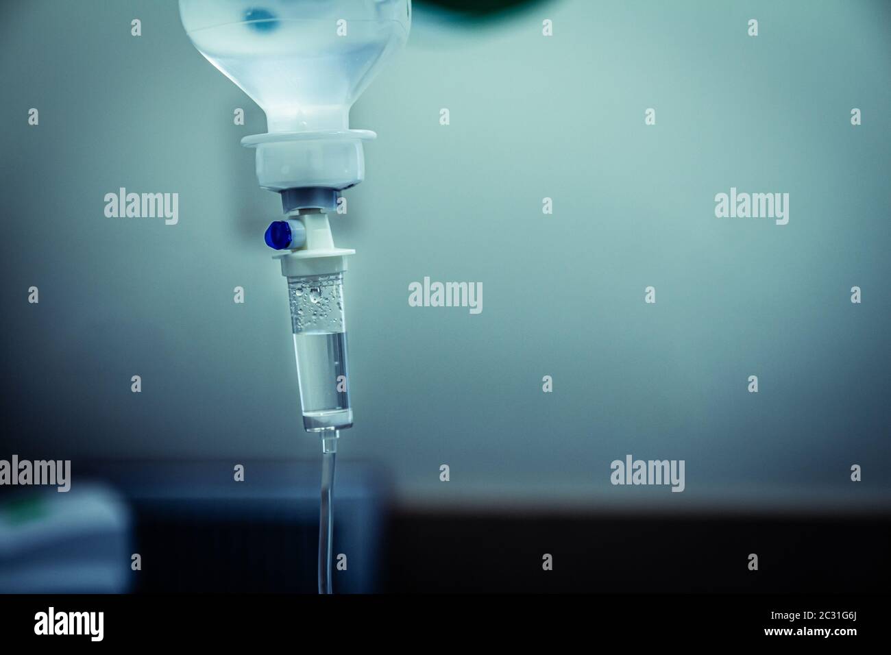 Set IV fluid intravenous drop saline drip in a hospital room. Close up ...