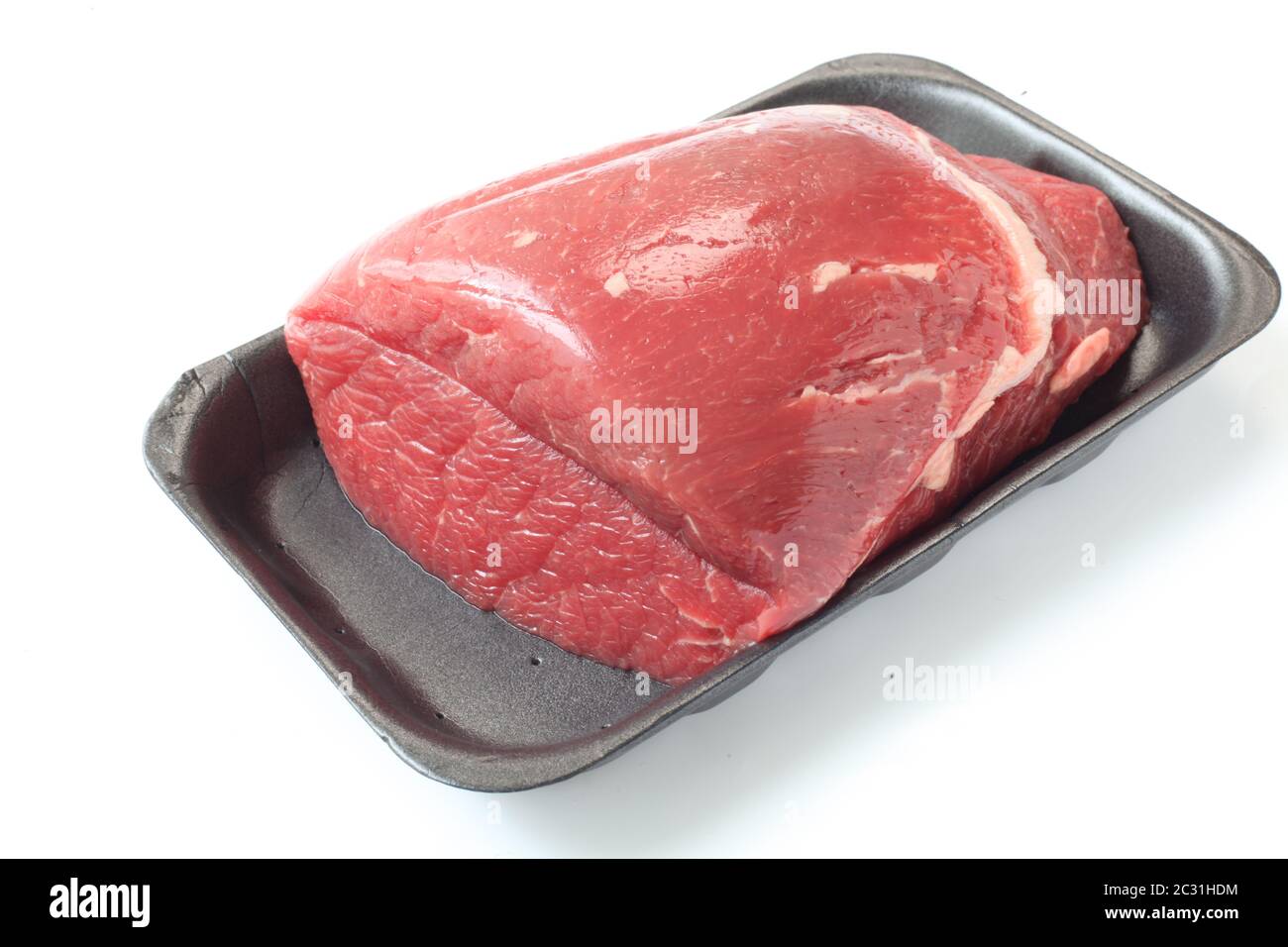 Raw Beef Joint In A Plastic Tray Isolated On White Stock Photo - Alamy