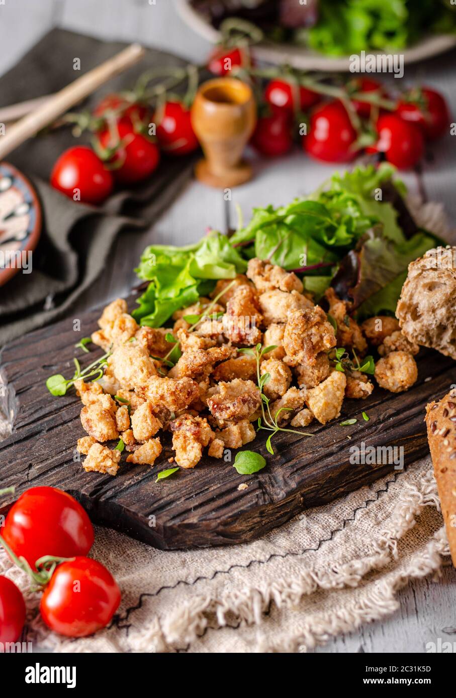 Delicious fat food, fried greaves pork with garlic Stock Photo - Alamy